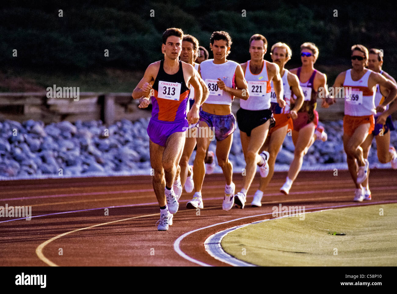 Male runners competing in a track race Stock Photo - Alamy