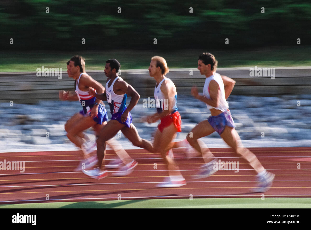 Male runners competing in a track race Stock Photo - Alamy