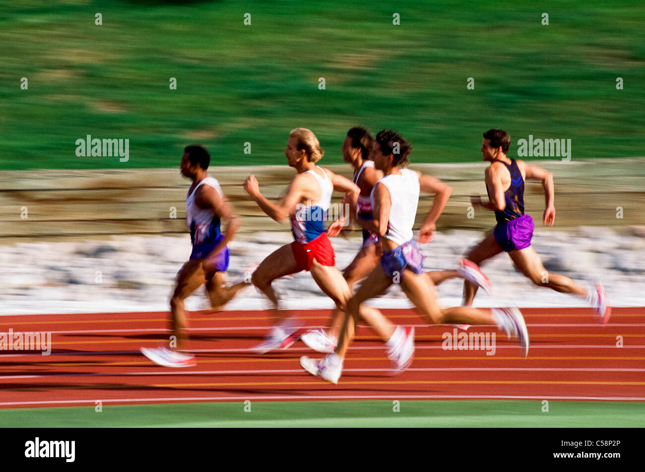 Male runners competing in a track race Stock Photo - Alamy