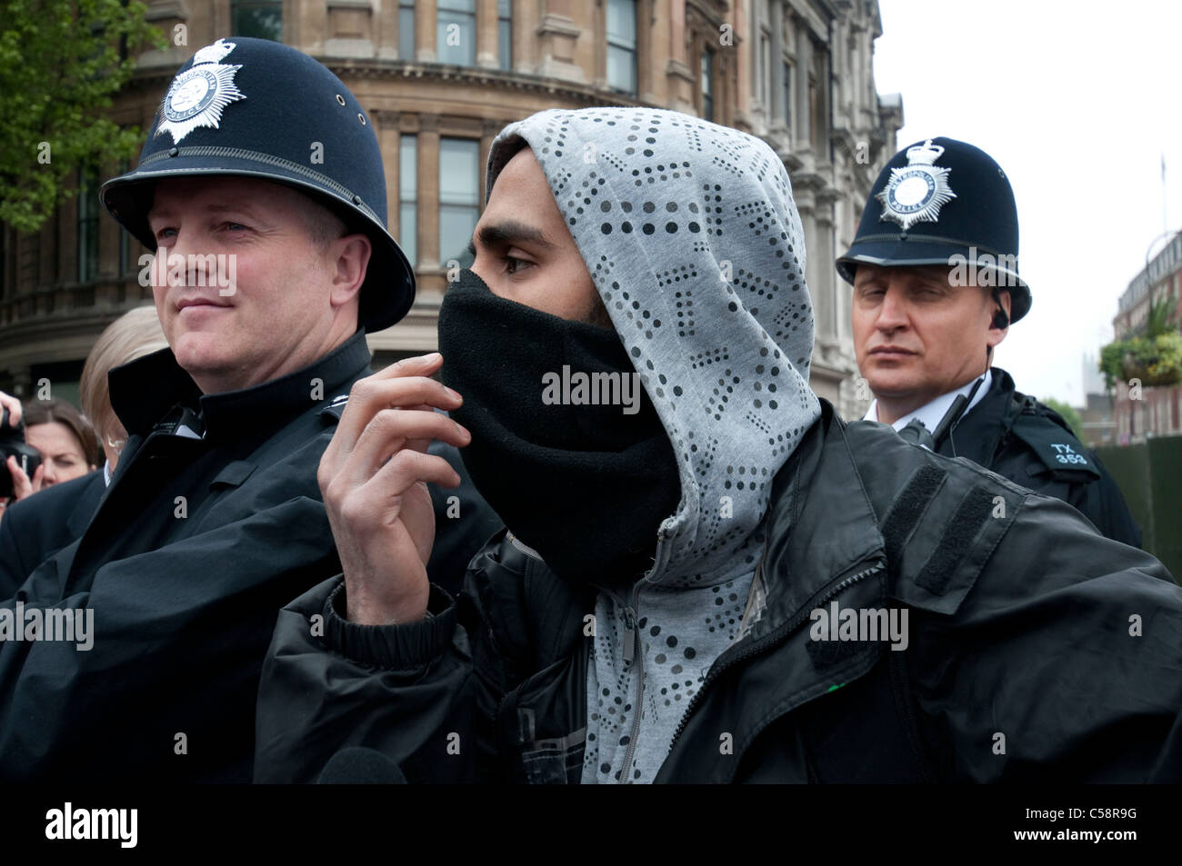 Masked youth and police officers Stock Photo - Alamy