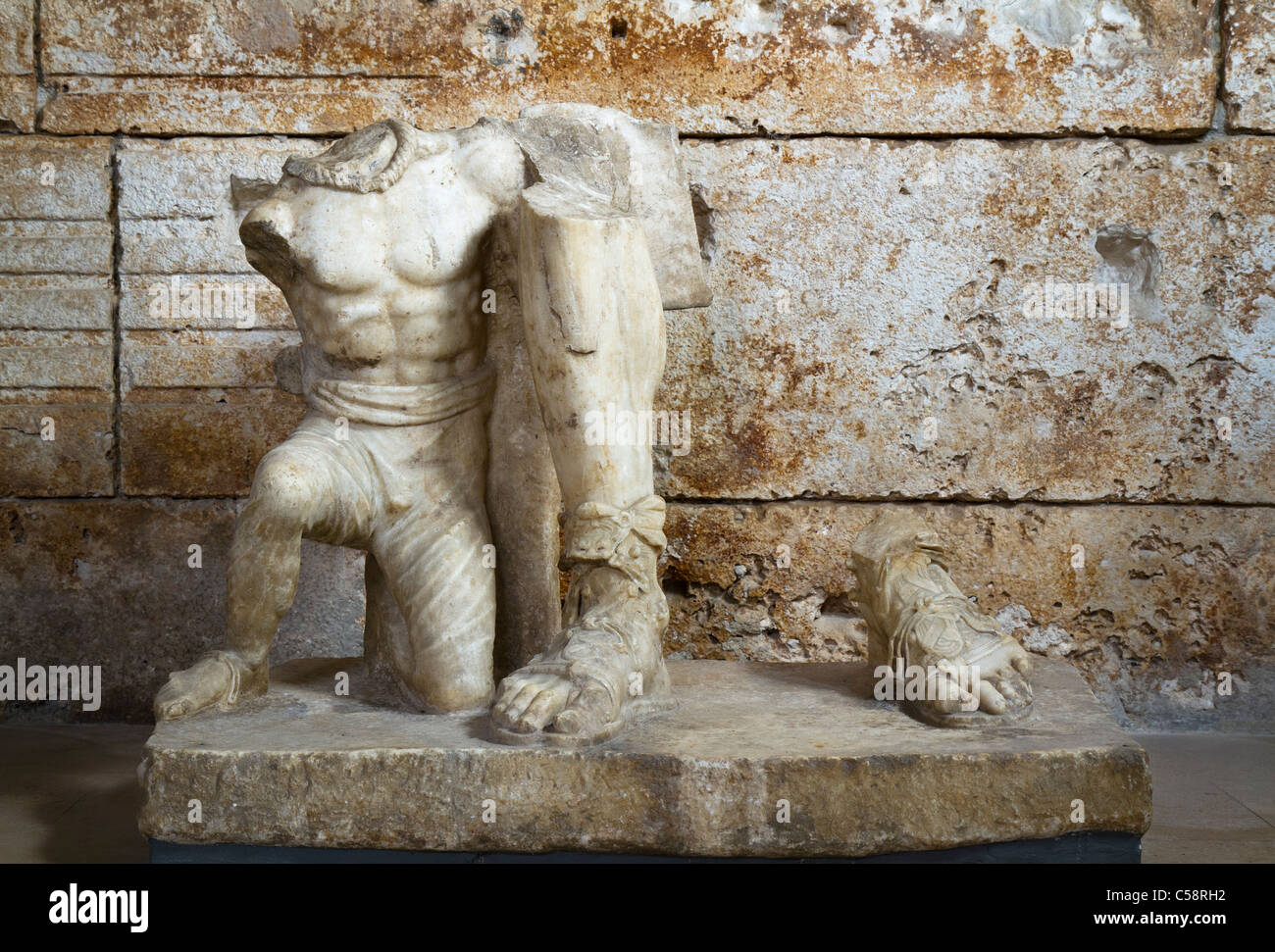 Fragment of a statue of a Roman emperor with a diminutive, captive Gaul ...