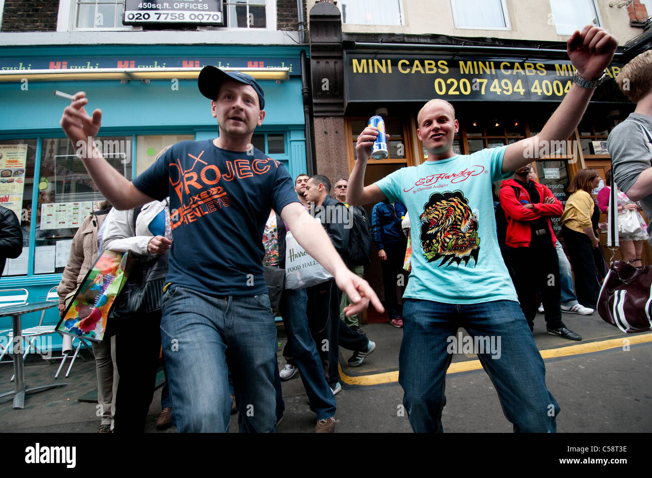 Men drinking in street outside pub london Stock Photo - Alamy