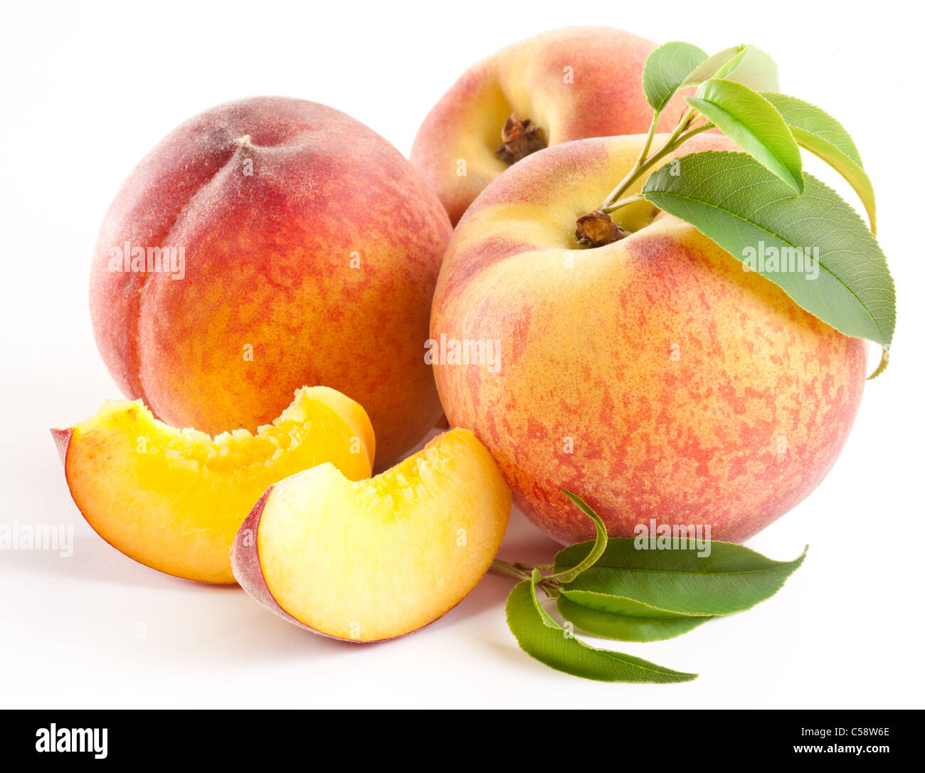 Ripe peach fruit with leaves and slises on white background Stock Photo ...