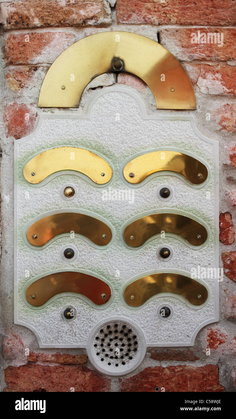 An intercom doorbell panel on the brick wall Stock Photo - Alamy