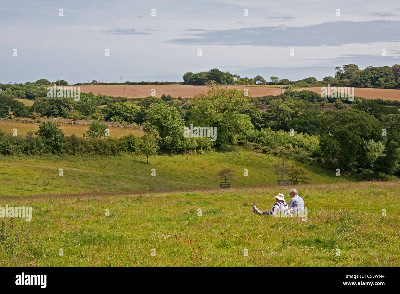 Couple enjoying scenery on summers day Stock Photo - Alamy