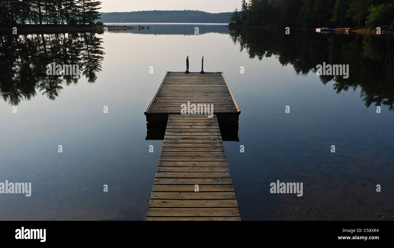 Cottage Boat Dock Stock Photo - Alamy