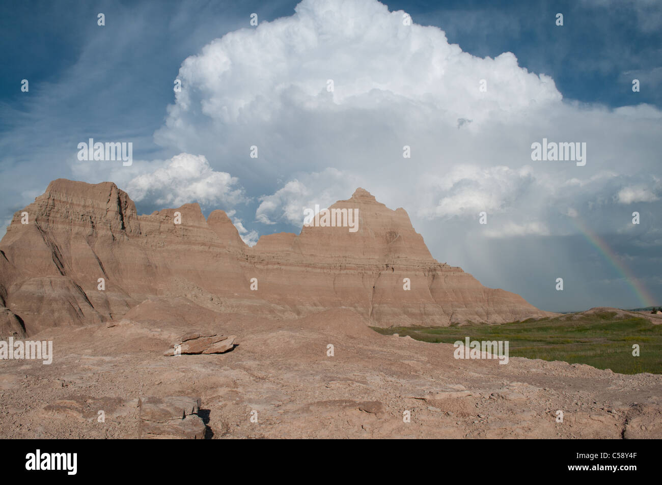 A rainbow appears over Badlands National Park after a summer storm ...