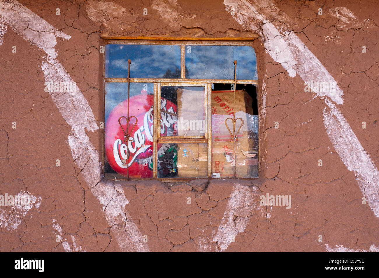 A window on a wall of a mud brick house on the island of Taquile on ...