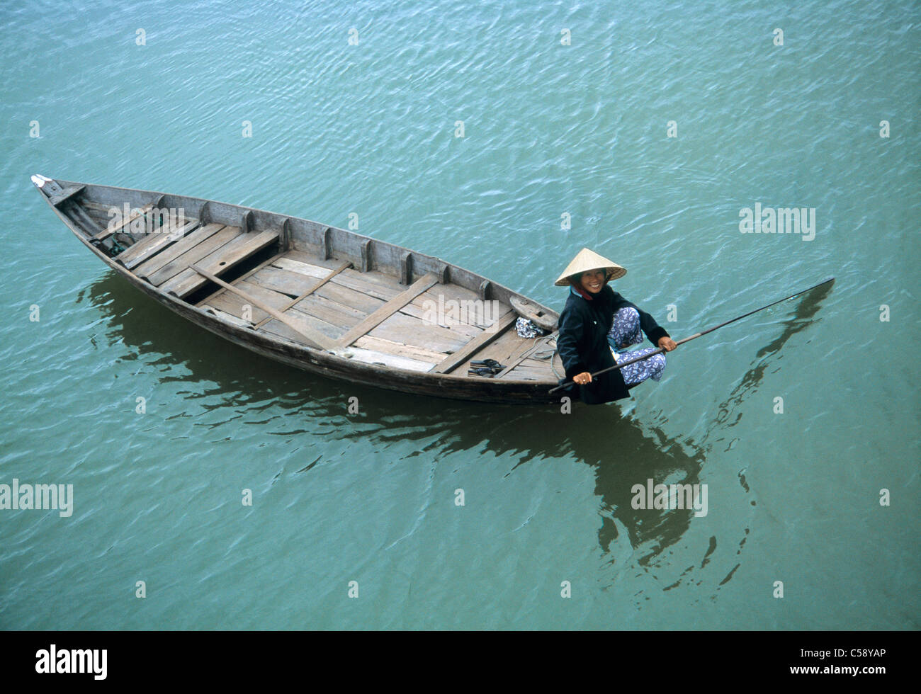 A Vietnamese woman rowing a boat, Hoi An, Vietnam Stock Photo - Alamy