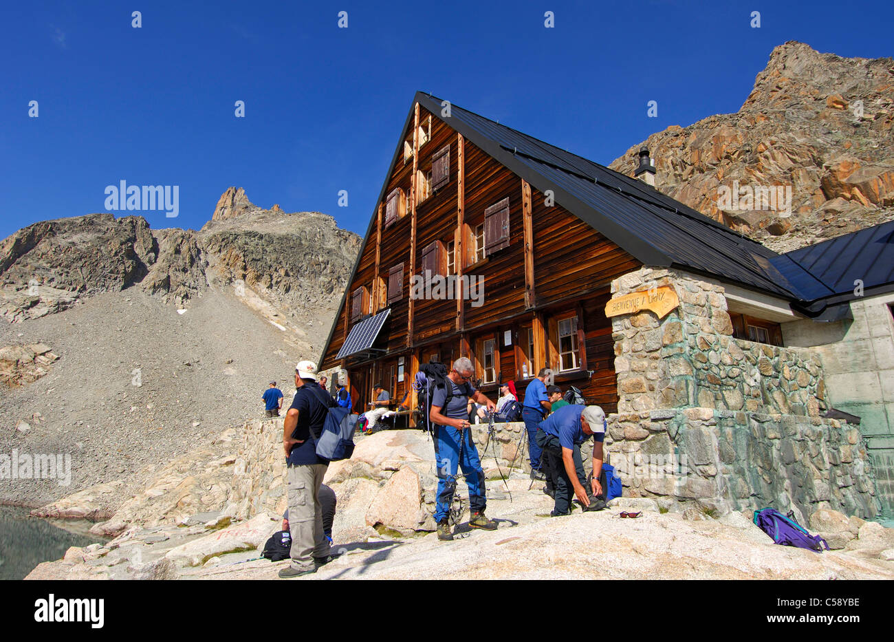 Hikers and alpinists at the Orny mountainhut of the Swiss Alpine Club ...
