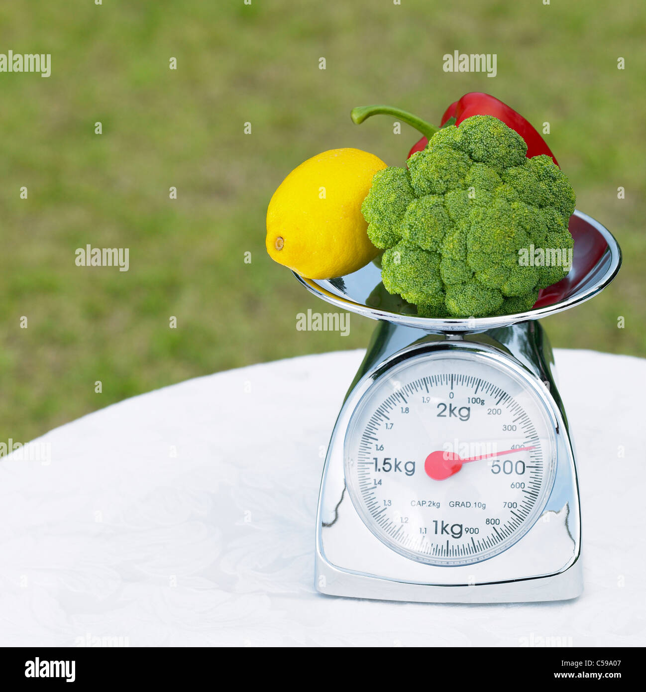 Vegetables on weight scale Stock Photo - Alamy