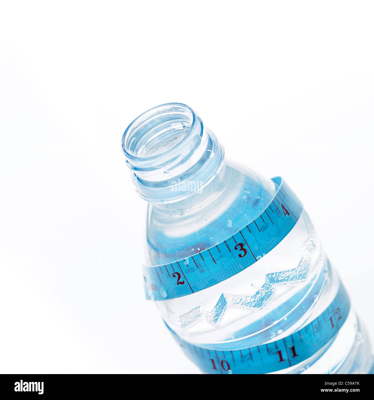 Close-up of water bottle wrapped with measuring tape Stock Photo - Alamy