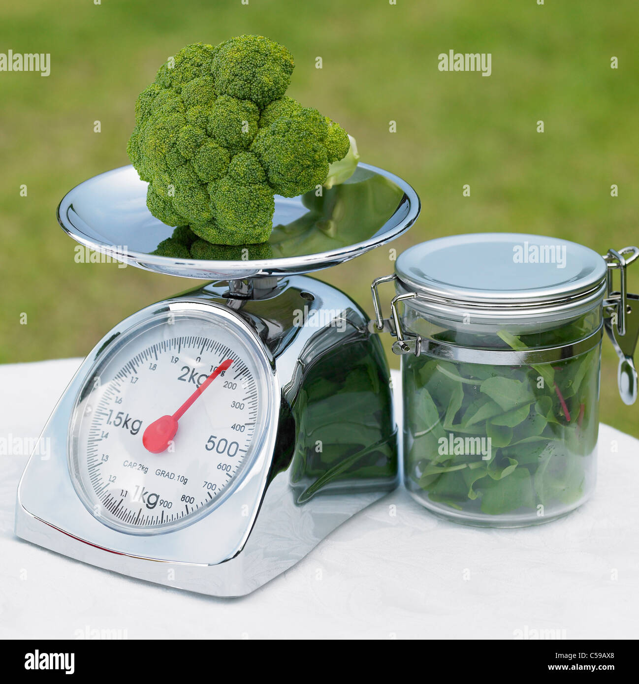 Vegetables on weight scale Stock Photo - Alamy