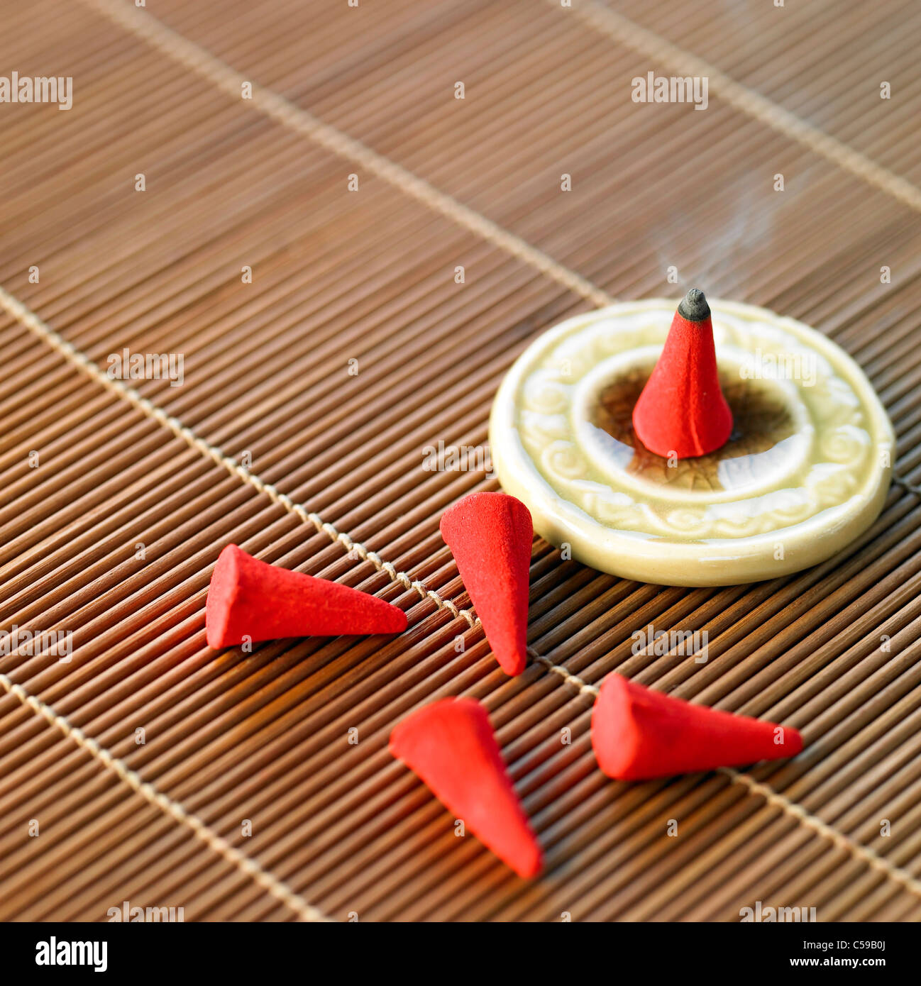 Close-up of cone shaped incense sticks in plate Stock Photo - Alamy