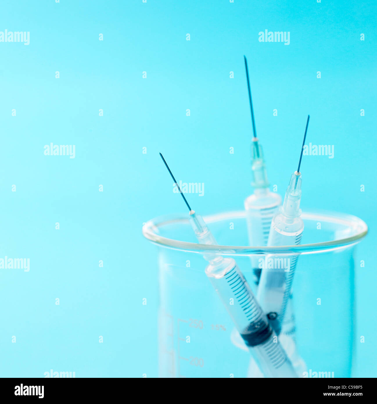 Close-up of Syringe in Beaker Stock Photo - Alamy