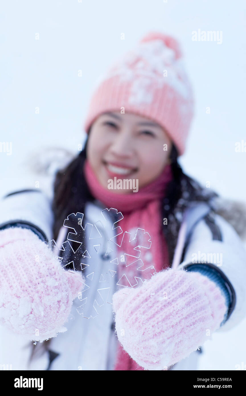 Young woman enjoying snowflakes Stock Photo - Alamy