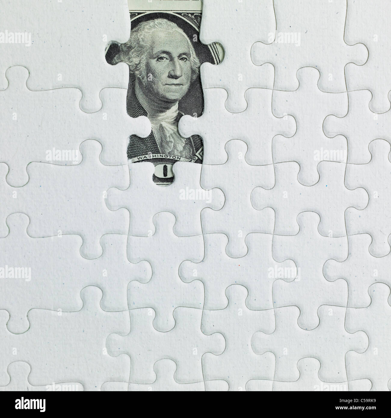 Dollar Bill Behind Jigsaw Puzzle Stock Photo - Alamy