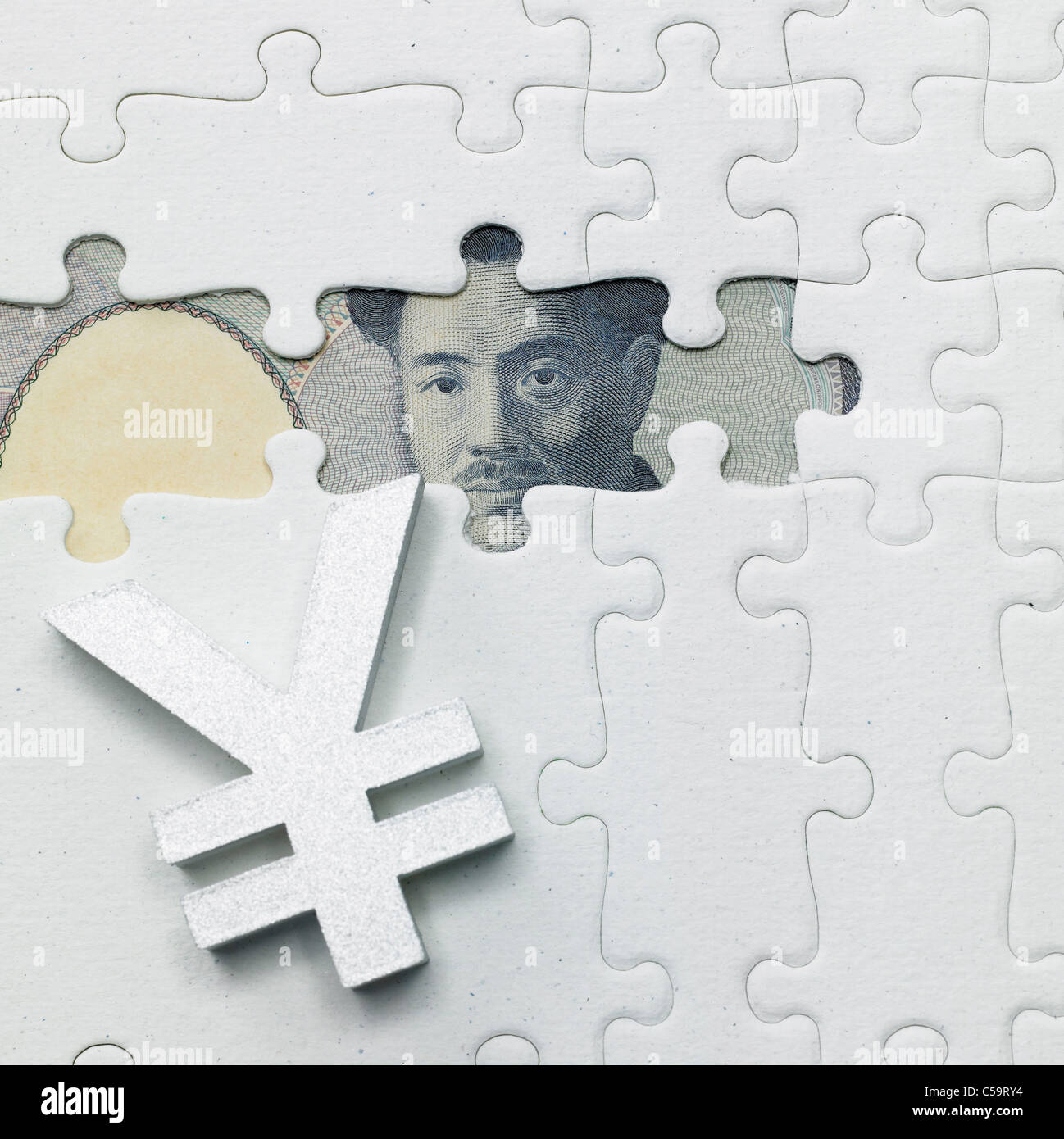 Close-up of Yen note and Puzzle with yen sign Stock Photo - Alamy
