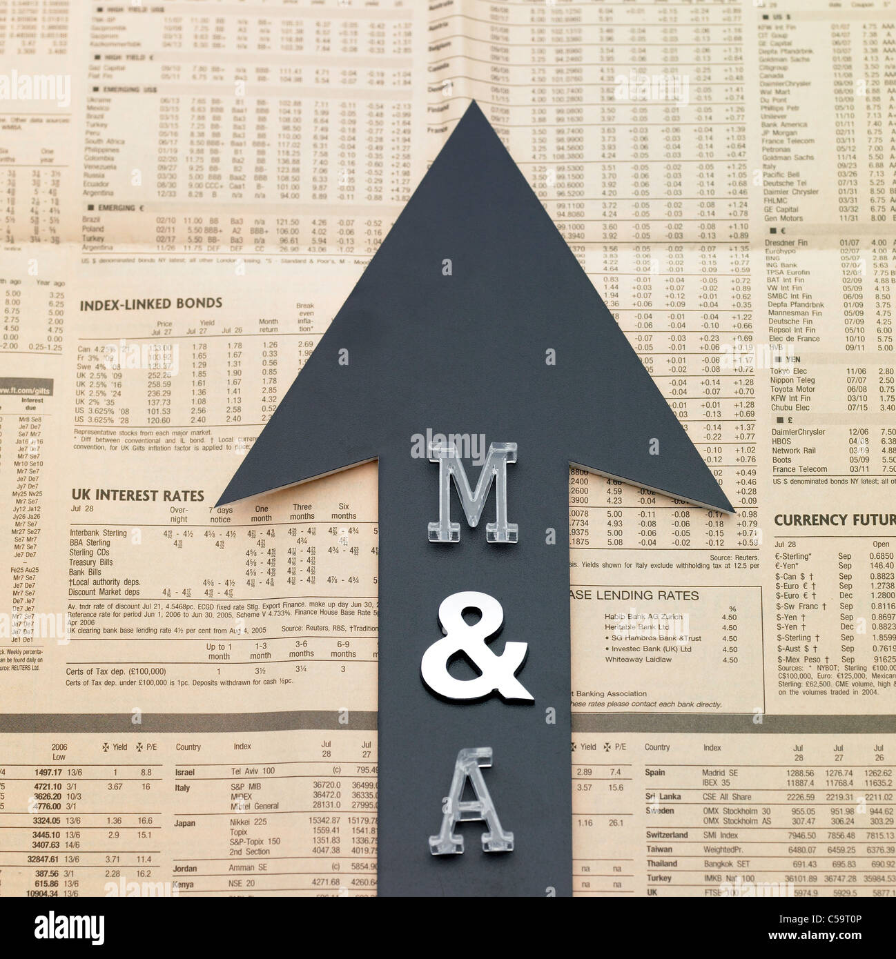 Close-up of Arrow sign with alphabets on Financial Newspaper Stock ...