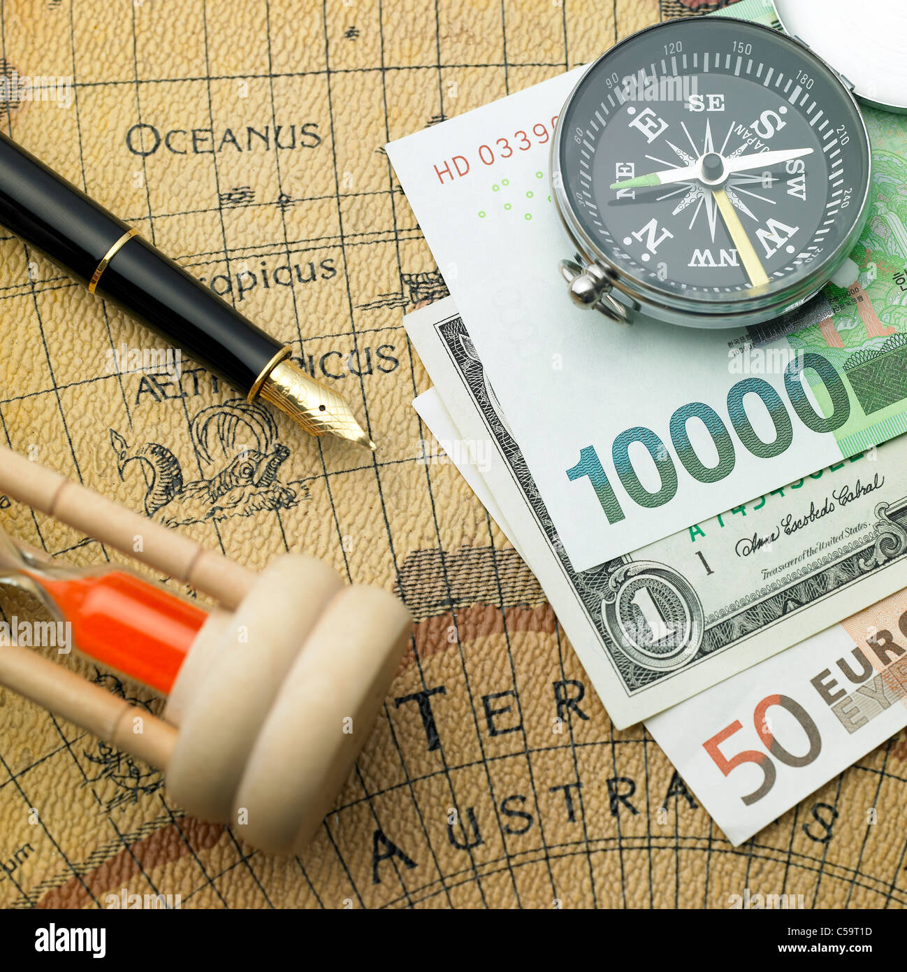 Close-up of Banknotes and compass on world map Stock Photo - Alamy
