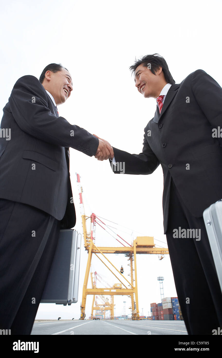 Half length smiling handshake shaking hands hi-res stock photography ...