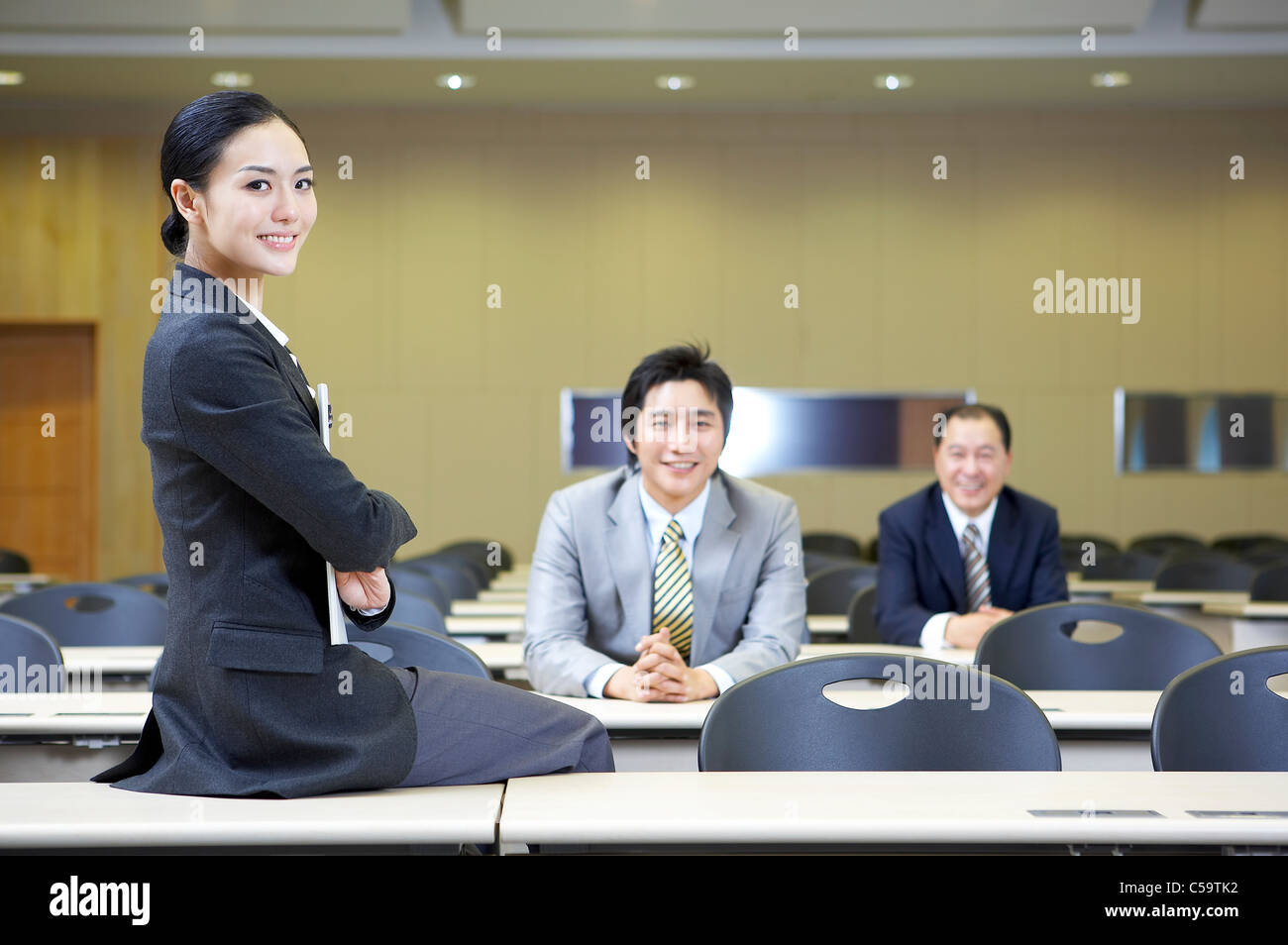 Portrait of businesspeople sitting in board room Stock Photo - Alamy