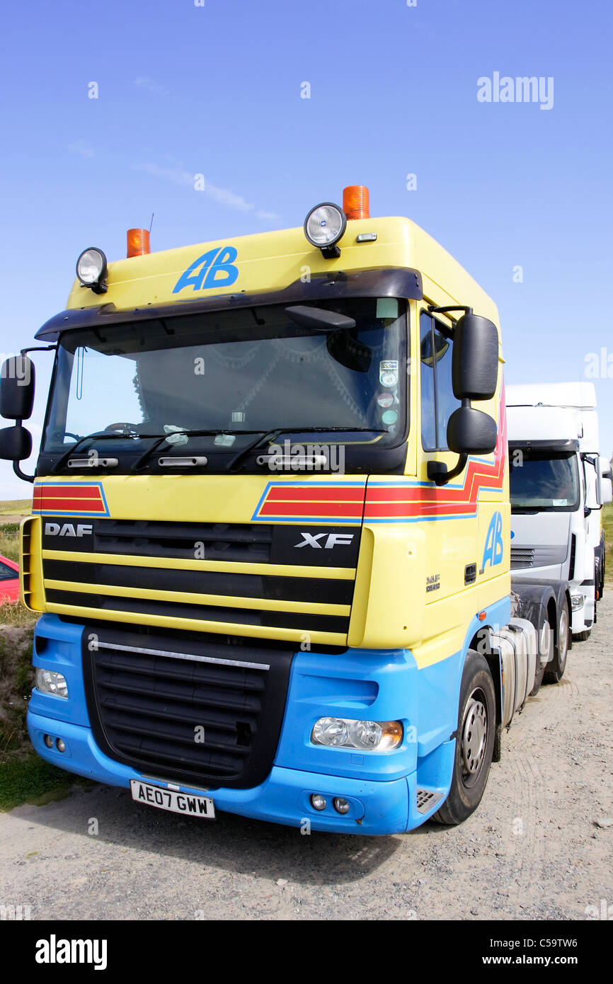Lorries parked on a beach side car park on the Isle of Anglesey,North ...