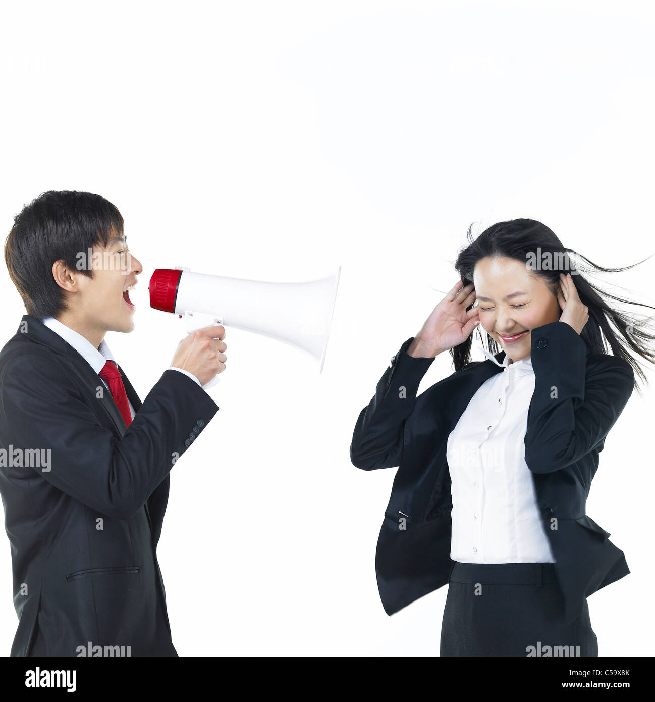 Side view of businessman shouting with megaphone Stock Photo - Alamy