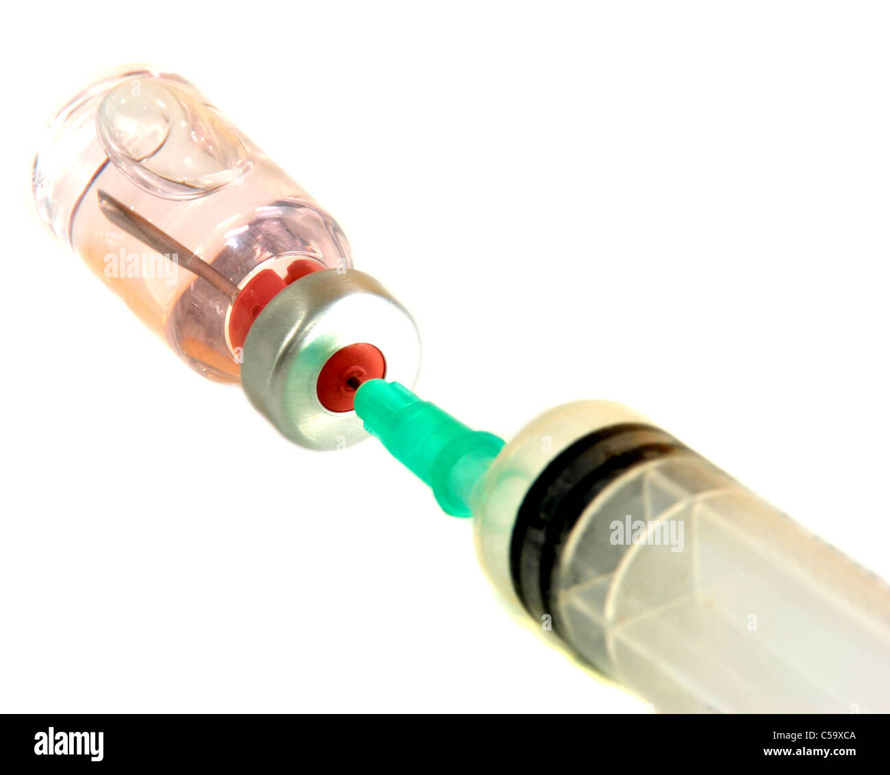 Syringe is filled with liquid from a vial Stock Photo - Alamy