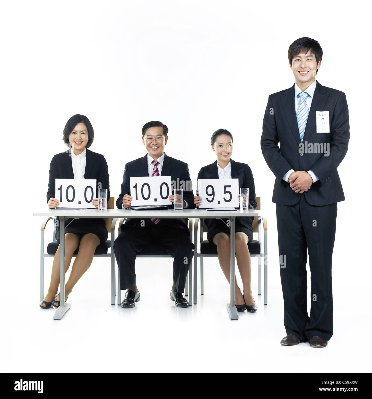 Portrait of businesspeople holding score cards Stock Photo - Alamy