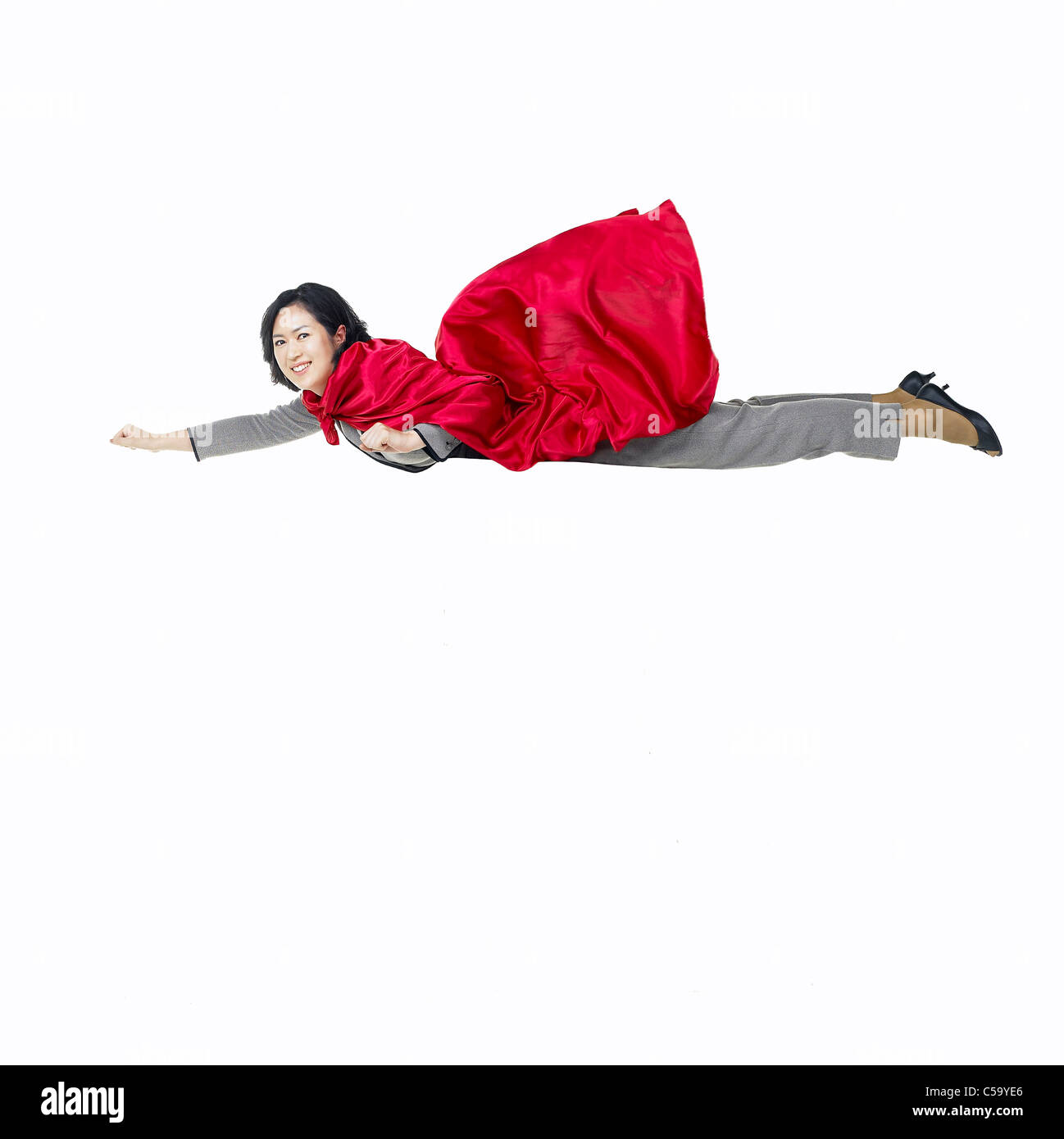 Portrait of businesswoman flying Stock Photo - Alamy