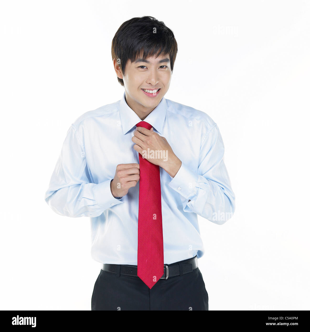 Portrait of businessman standing Stock Photo - Alamy