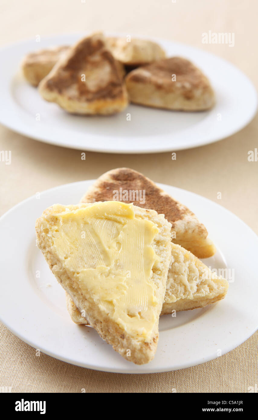 A buttered, traditional, homemade British griddle scone or girdle scone ...