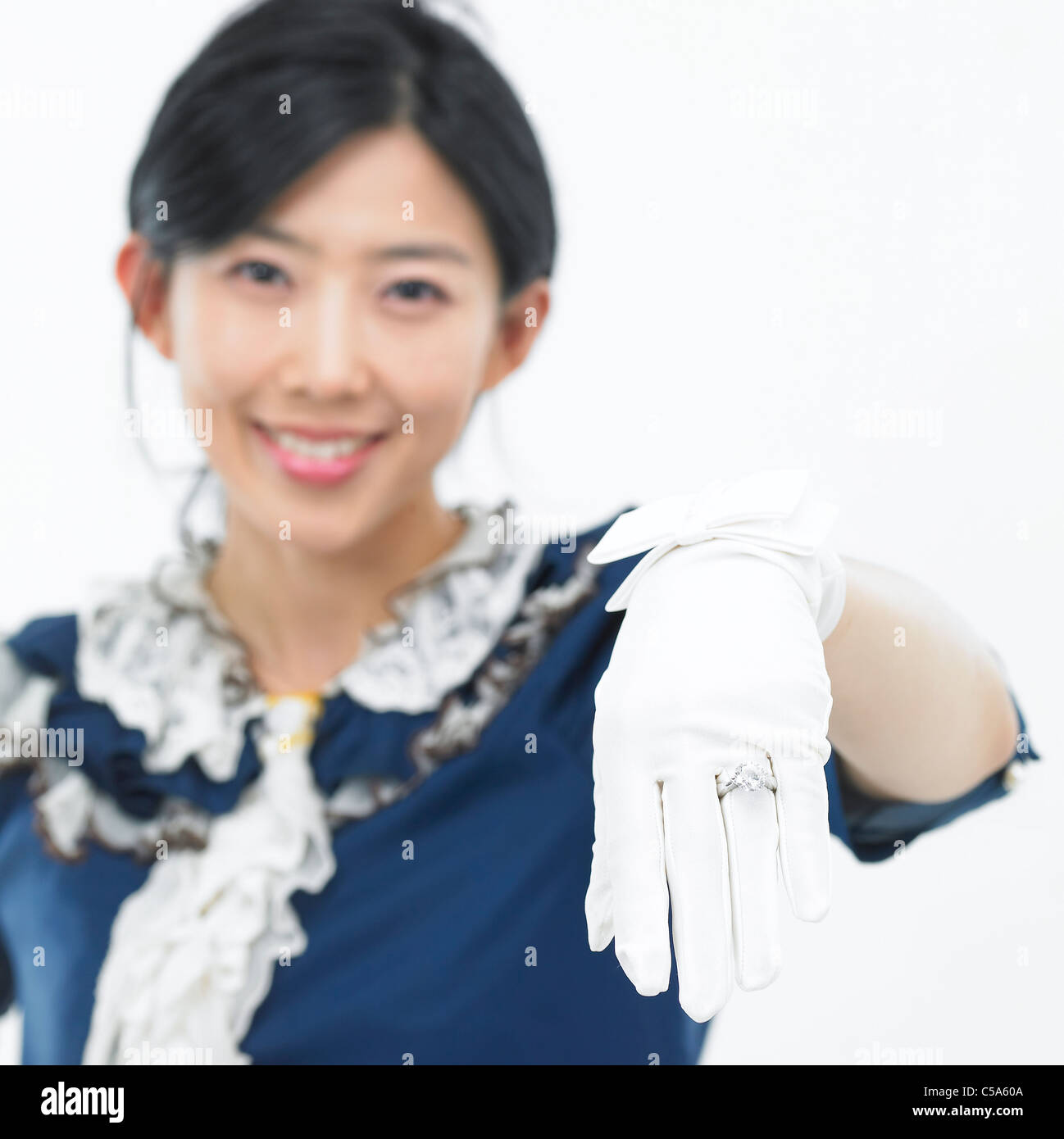 Portrait of young woman wearing ring Stock Photo - Alamy
