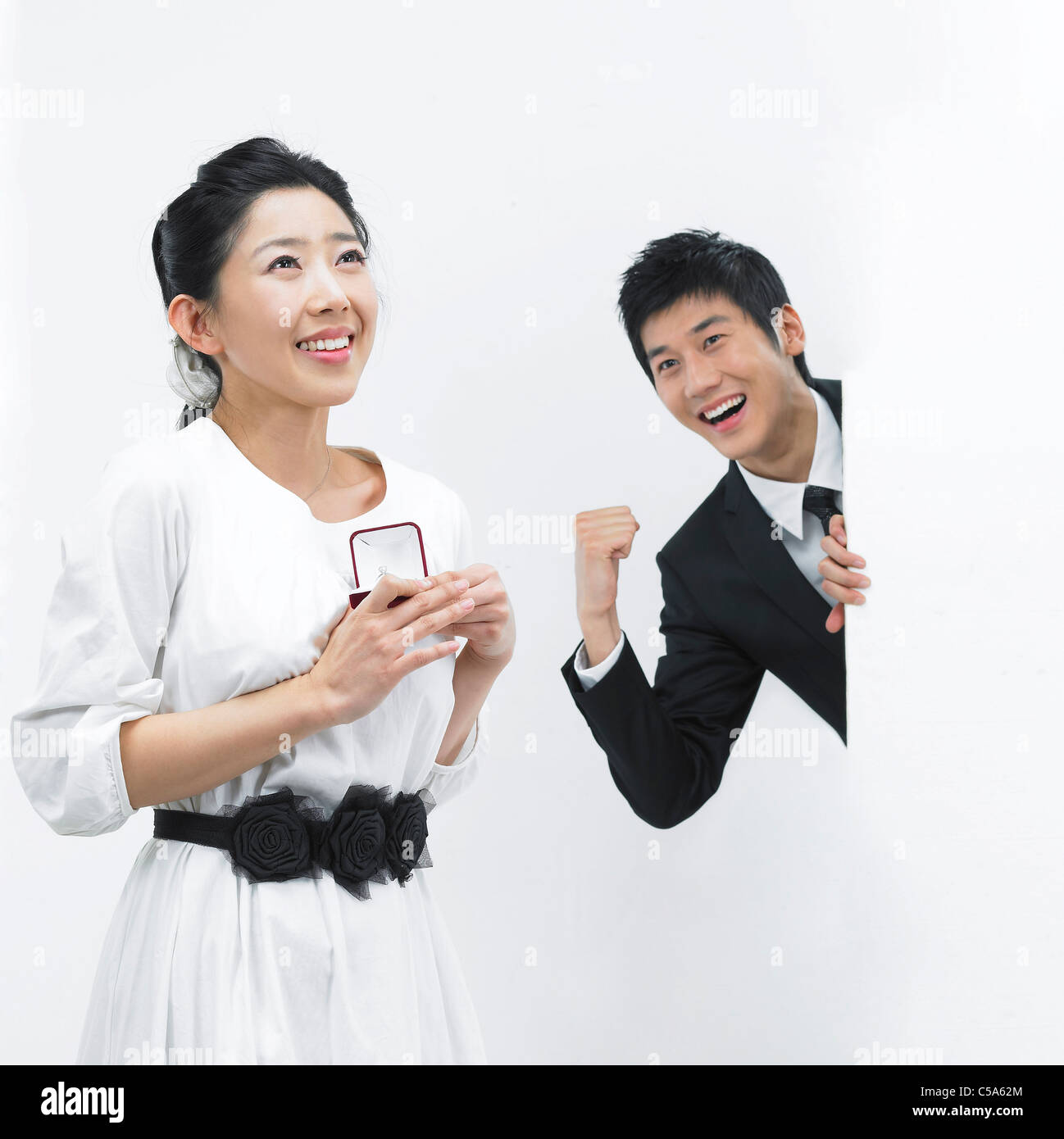 Close-up of young woman proposing young man Stock Photo - Alamy