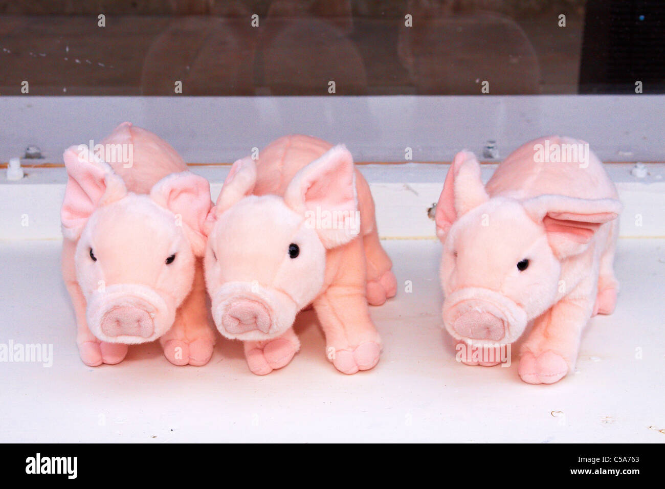 Three stuffed toy piglets Stock Photo - Alamy