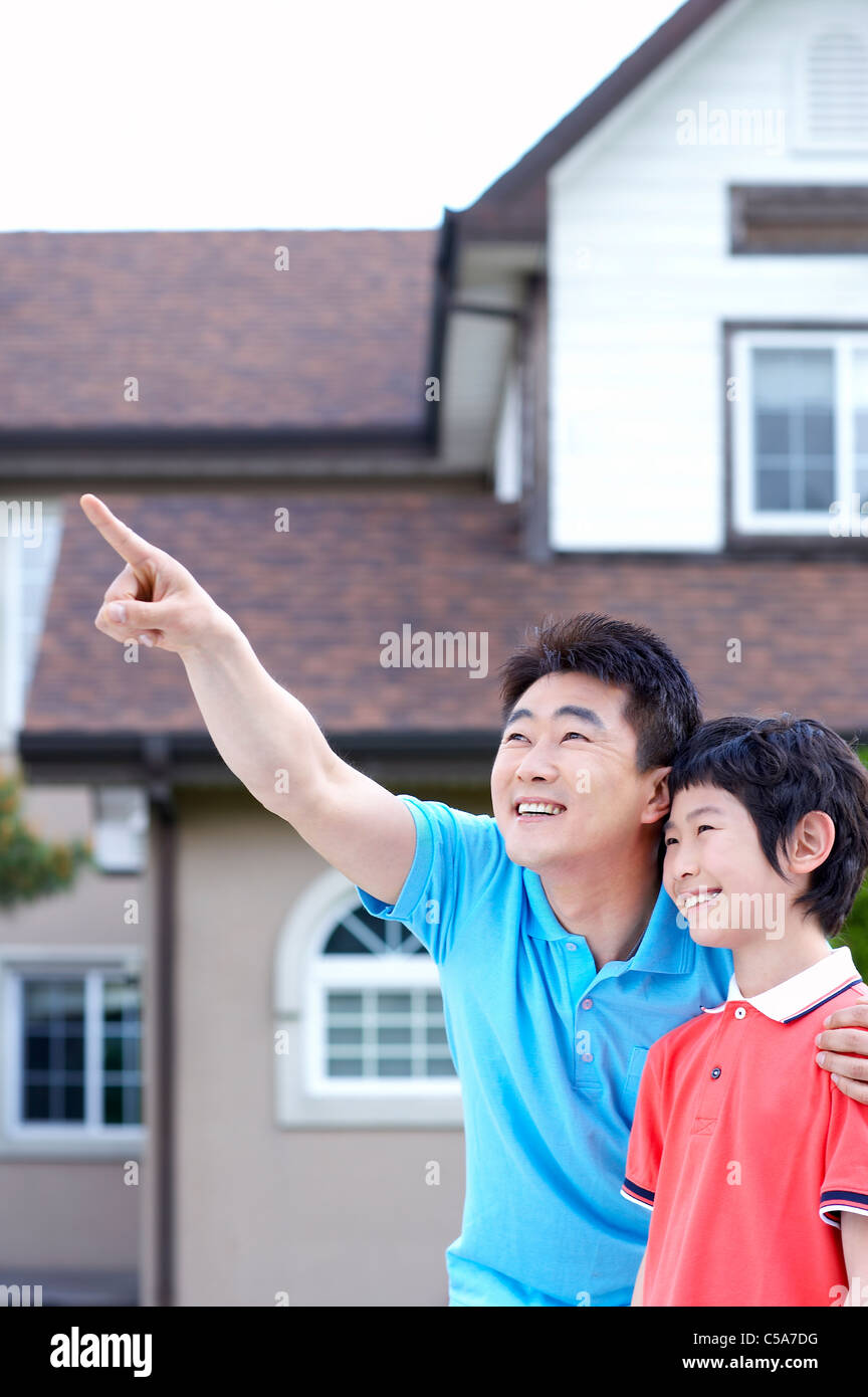 Side view of father and son smiling Stock Photo - Alamy