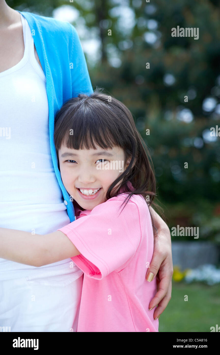 Portrait of daughter hugging mother Stock Photo - Alamy