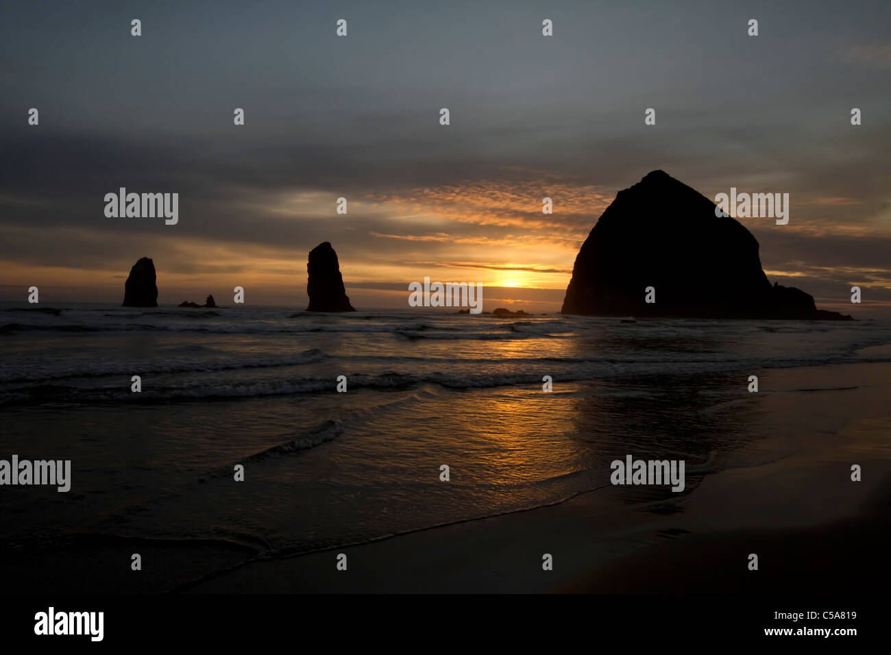 Sunset over Haystack Rock in Cannon Beach at Oregon Coast Stock Photo ...