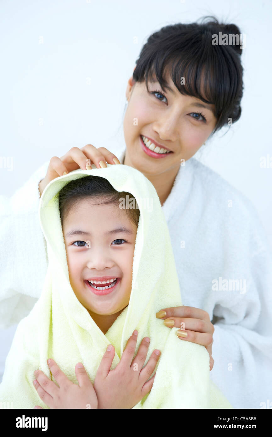 Portrait of mother drying daughter with towel Stock Photo - Alamy