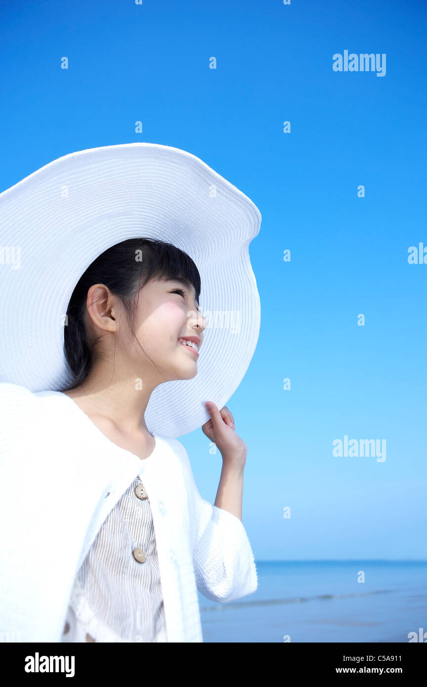 Side view of girl smiling Stock Photo - Alamy