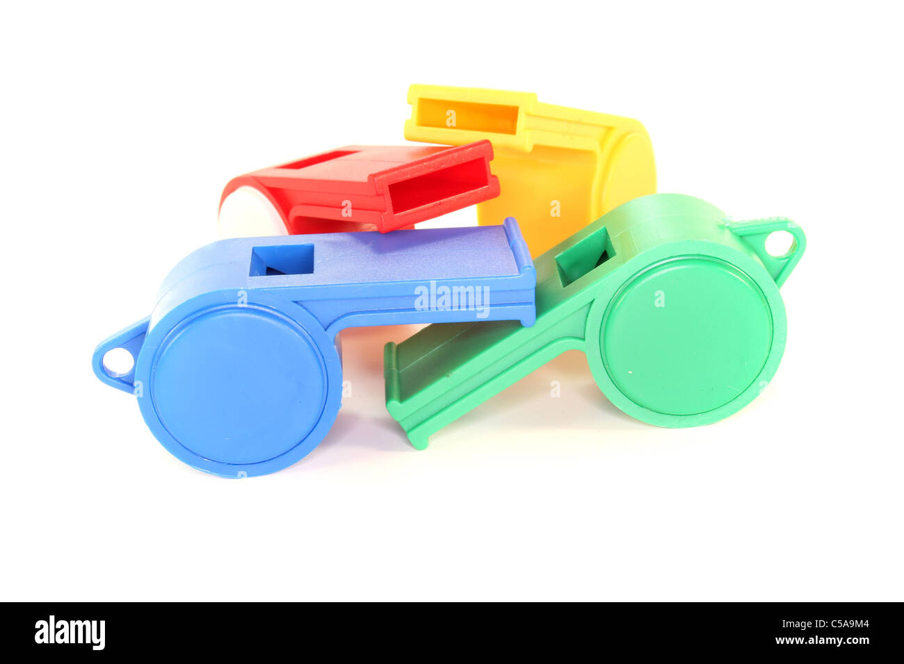 Colorful Trill whistles on a white background Stock Photo - Alamy
