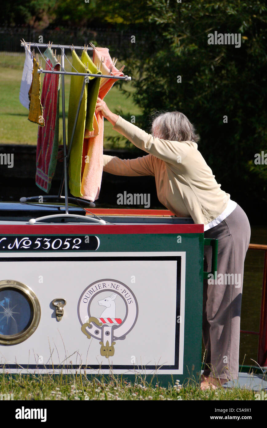 Old woman putting washing on line hi-res stock photography and images ...