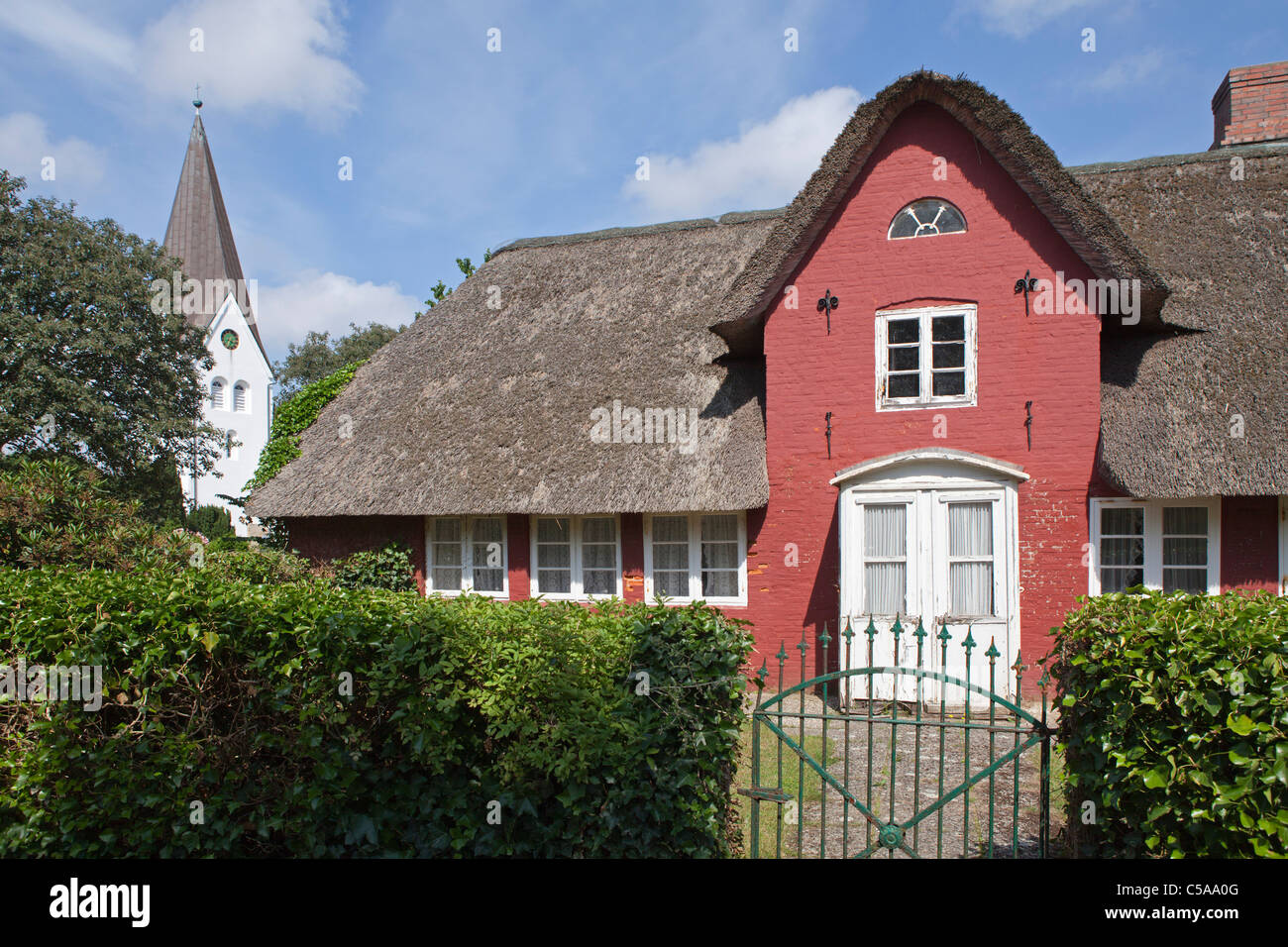thatched house and church, Nebel village, Amrum Island, North Friesland ...