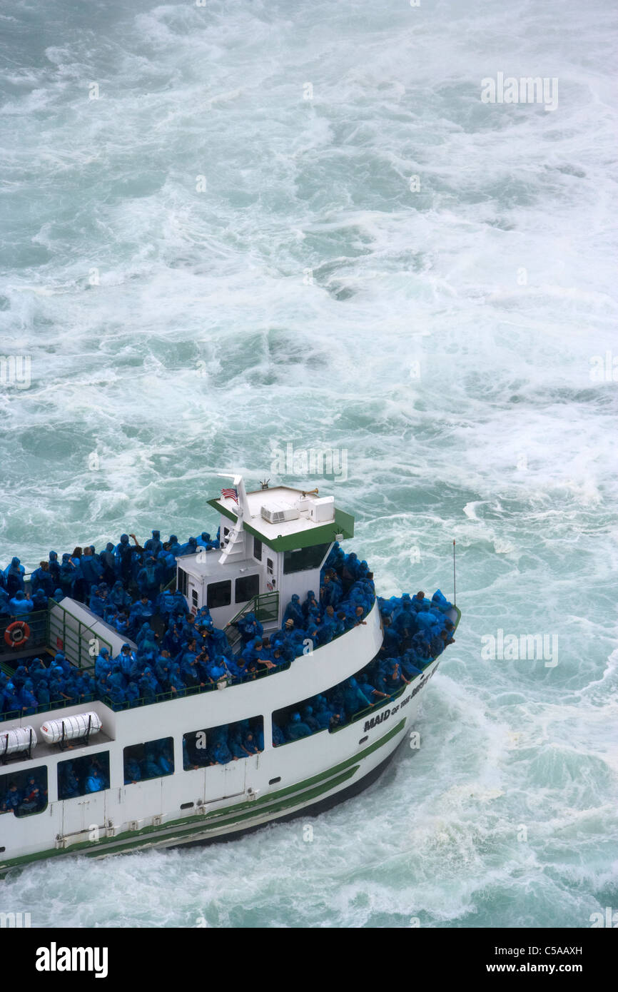 tourists on maid of the mist boat on the niagara river approaching ...