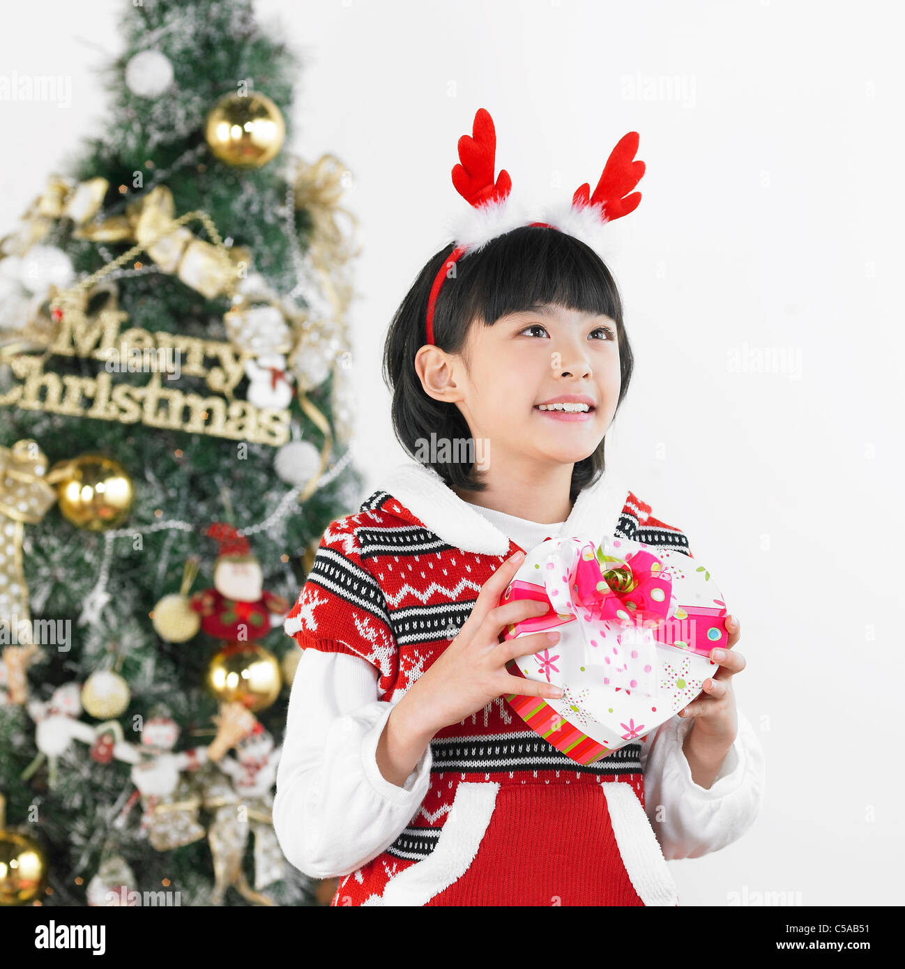 Girl holding gift box Stock Photo - Alamy