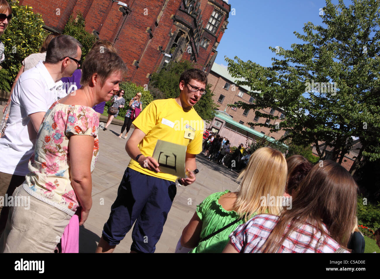 Newcastle University open day student in yellow shows parents around ...