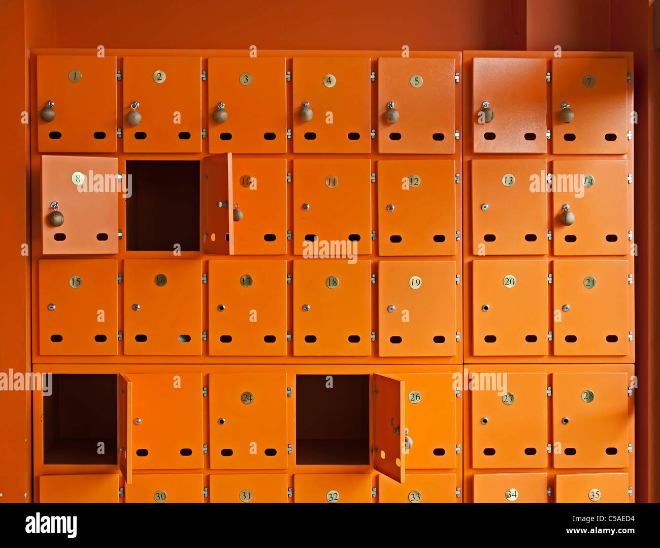 Many orange mailboxes. Some of them opened Stock Photo - Alamy