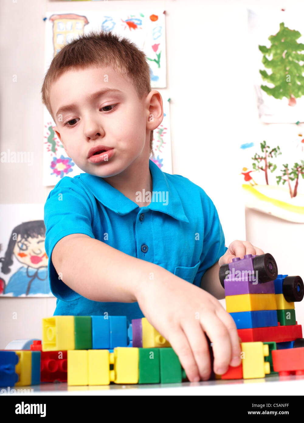 Child playing block and construction set Stock Photo - Alamy