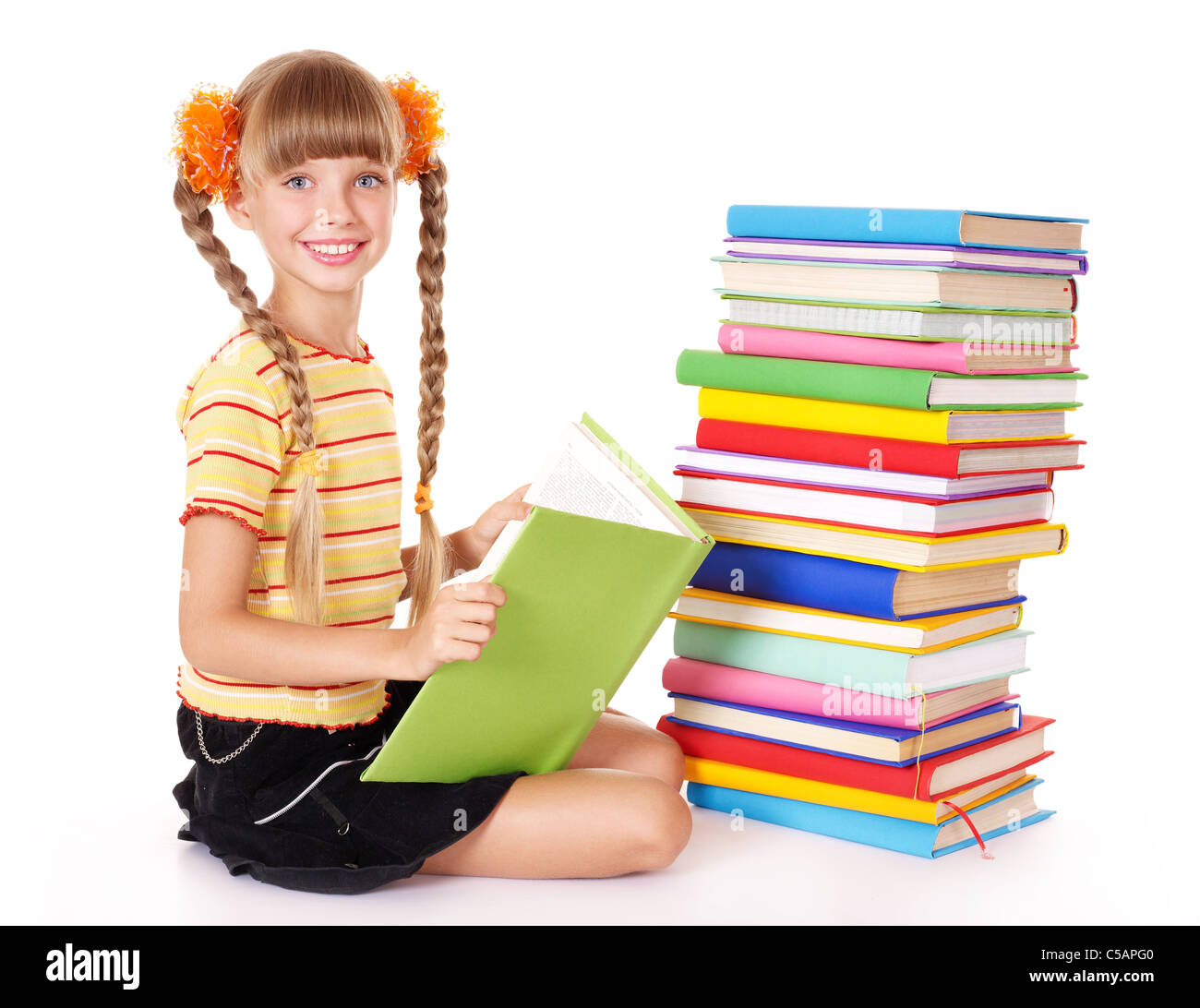 Child reading open book on table Stock Photo - Alamy